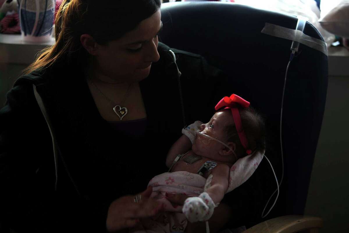 Baby born with heart outside her body goes home