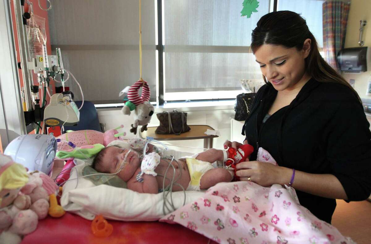Baby born with heart outside her body goes home