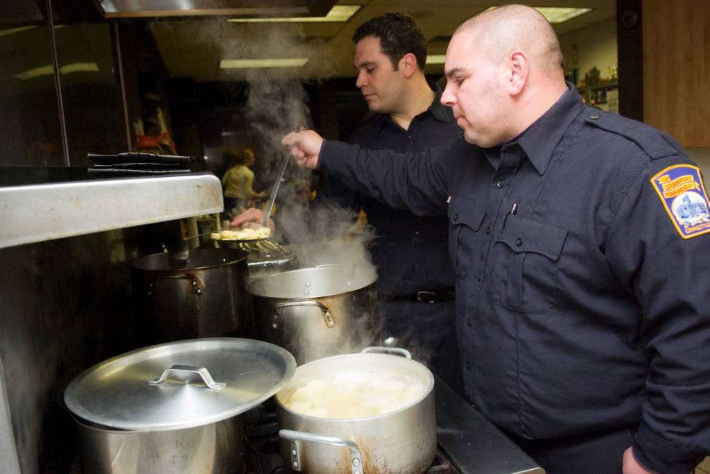 Firefighters cook holiday feast for 'second family'