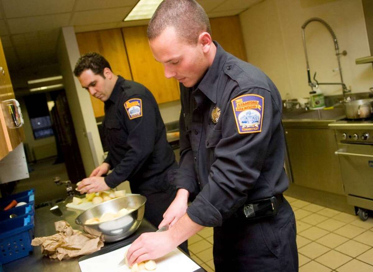 Firefighters cook holiday feast for 'second family'