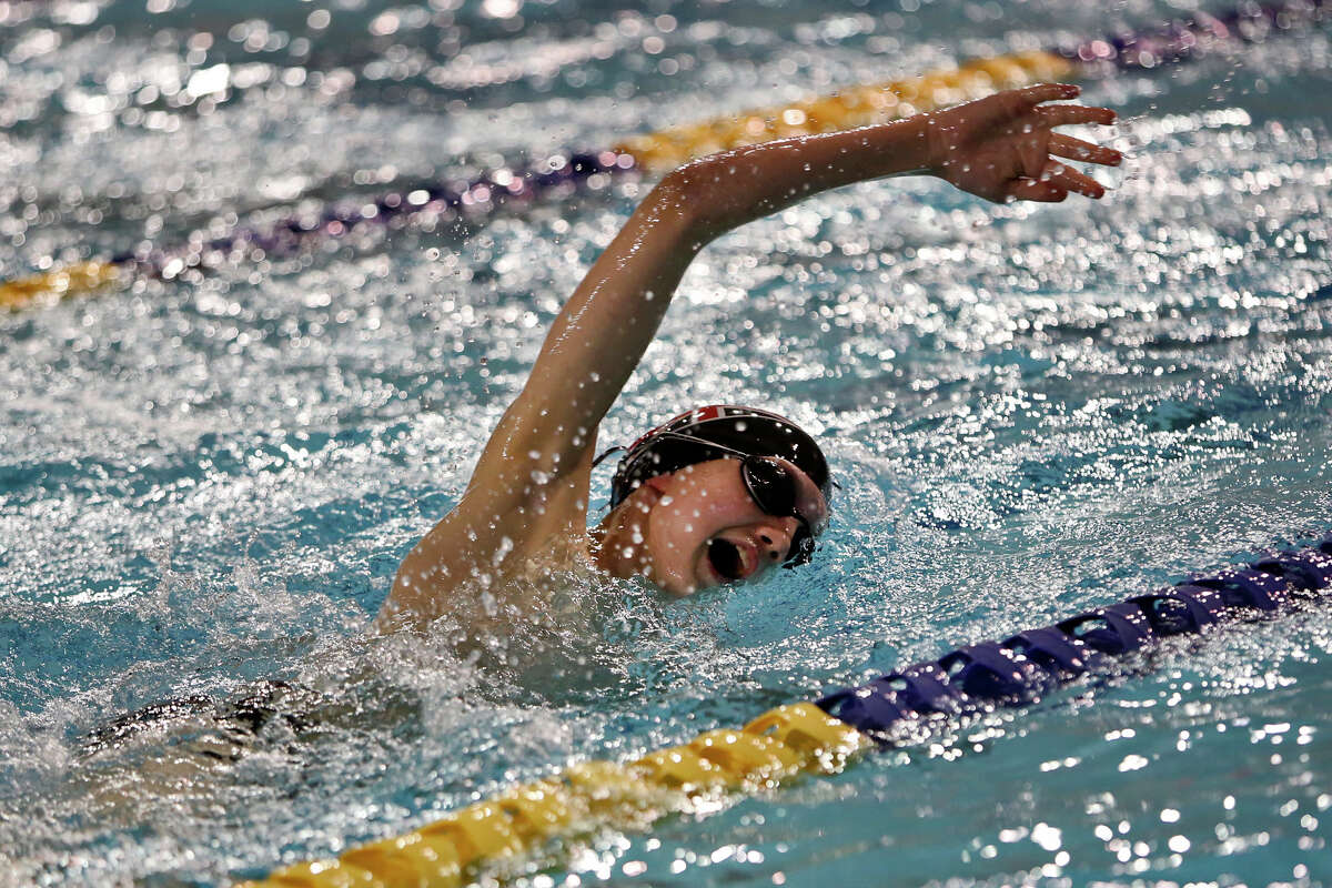 Teen swimmer always brings a four-footed life preserver