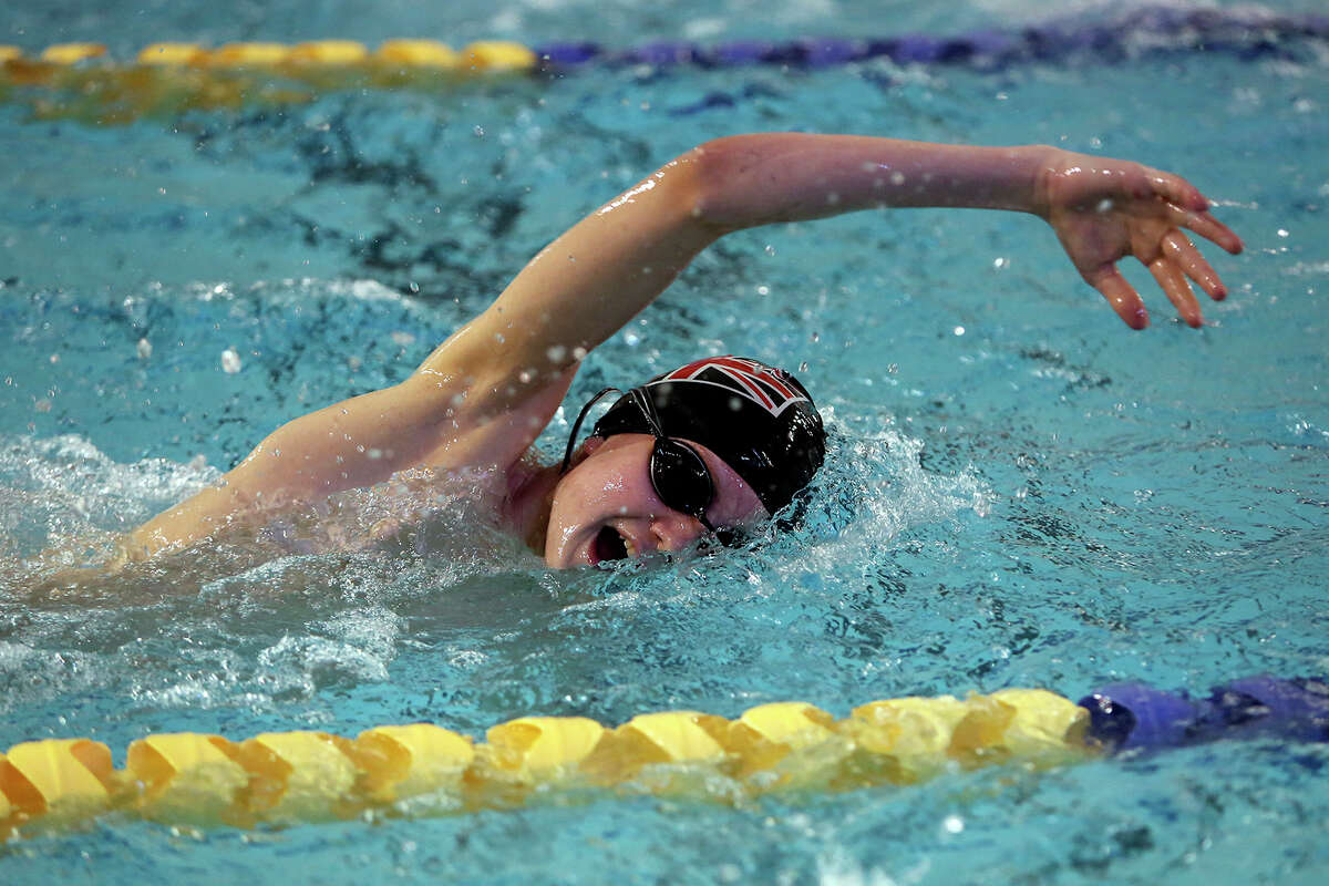 Teen swimmer always brings a four-footed life preserver