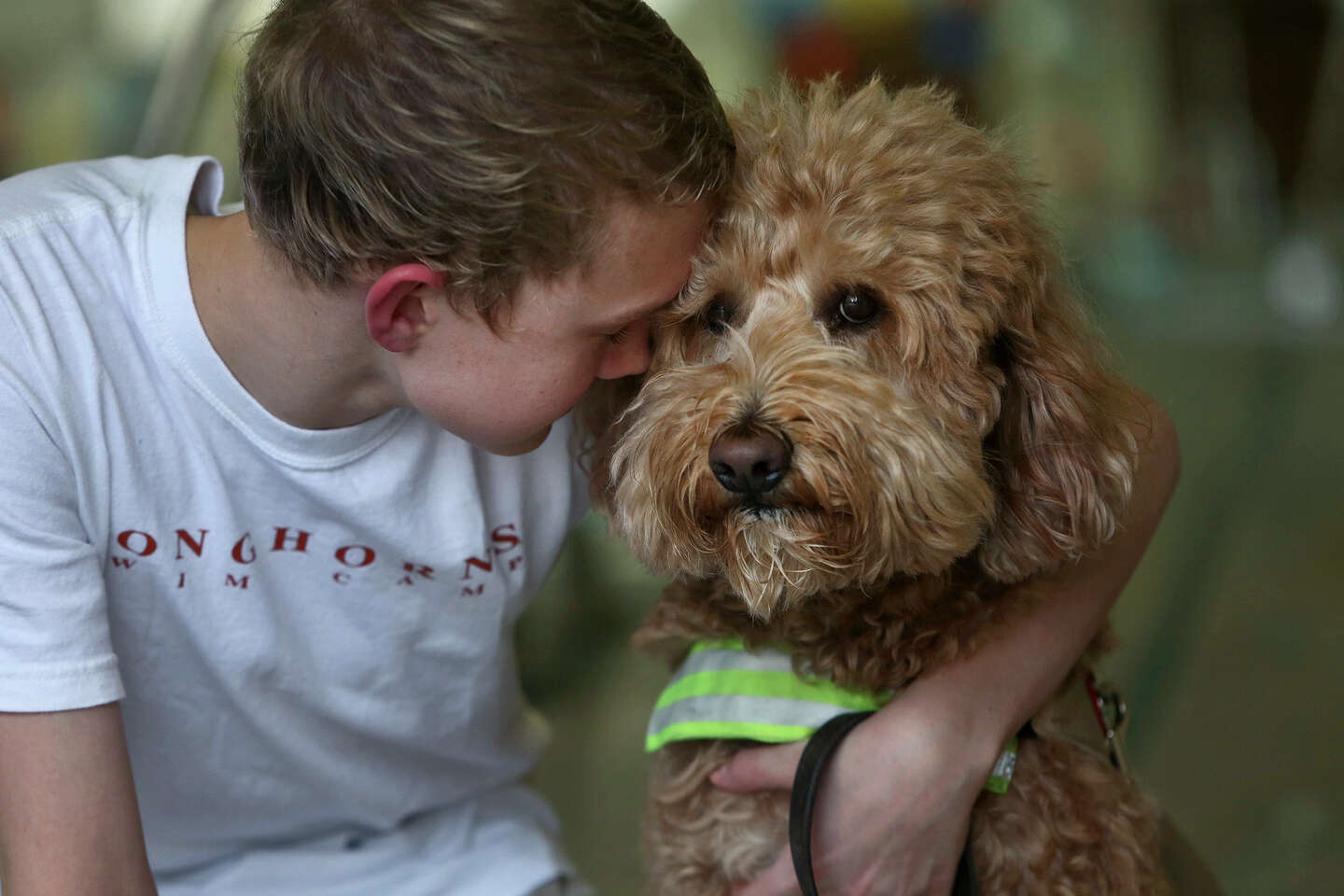 Teen swimmer always brings a four-footed life preserver