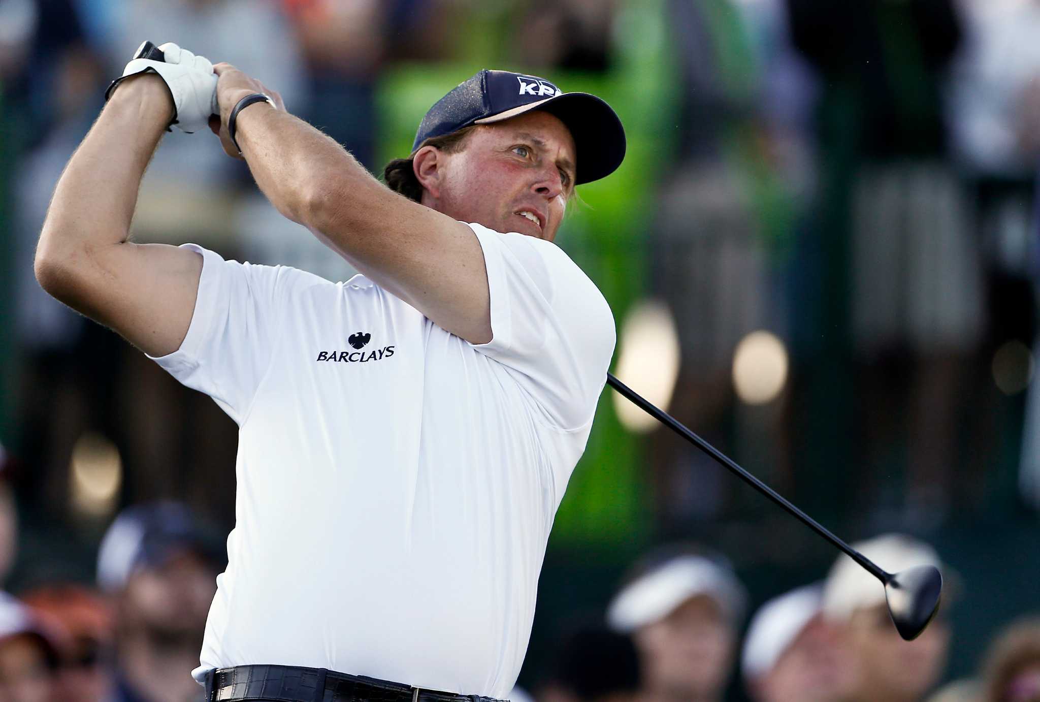Mickelson misses record but retains four-shot lead