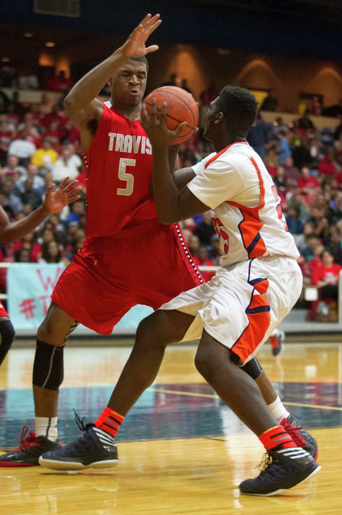 High school basketball: Bush 55, Travis 50