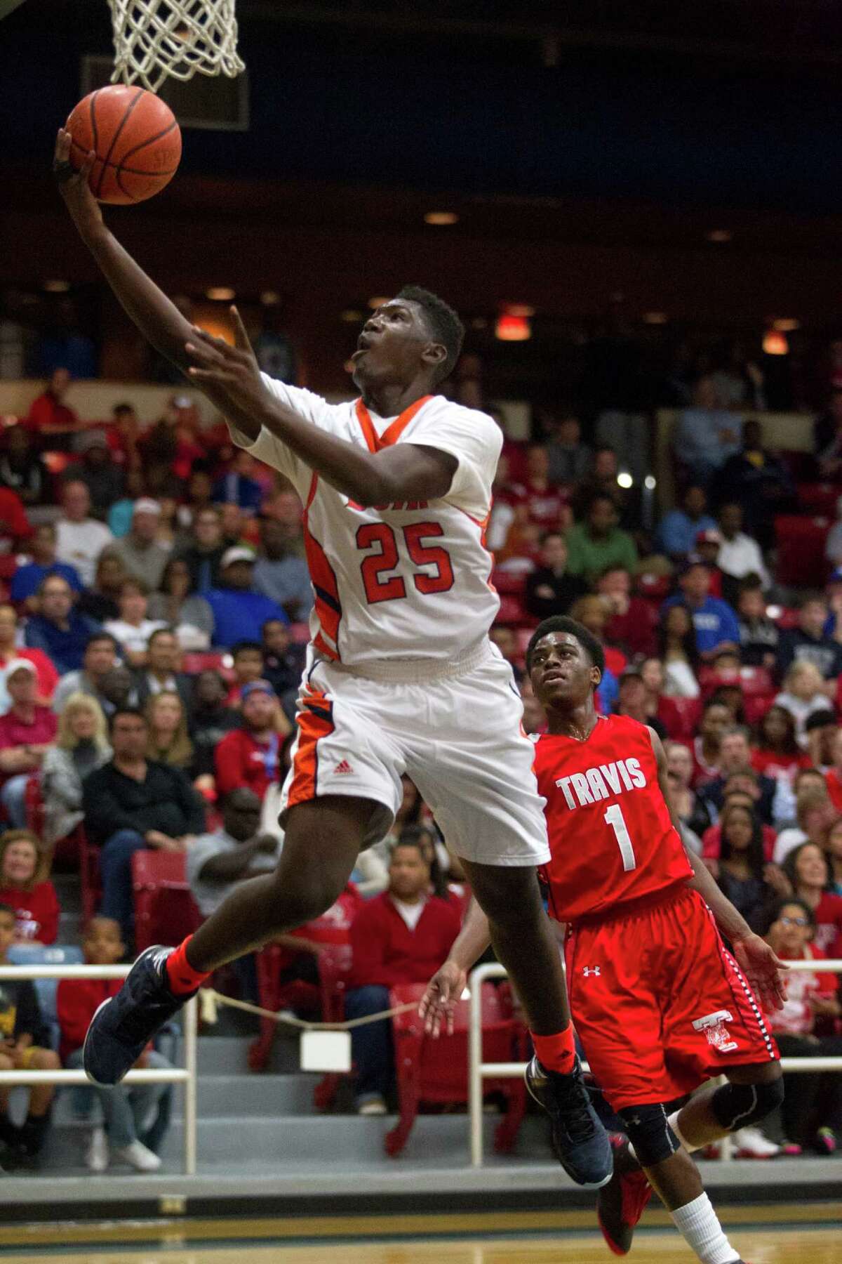 High school basketball: Bush 55, Travis 50