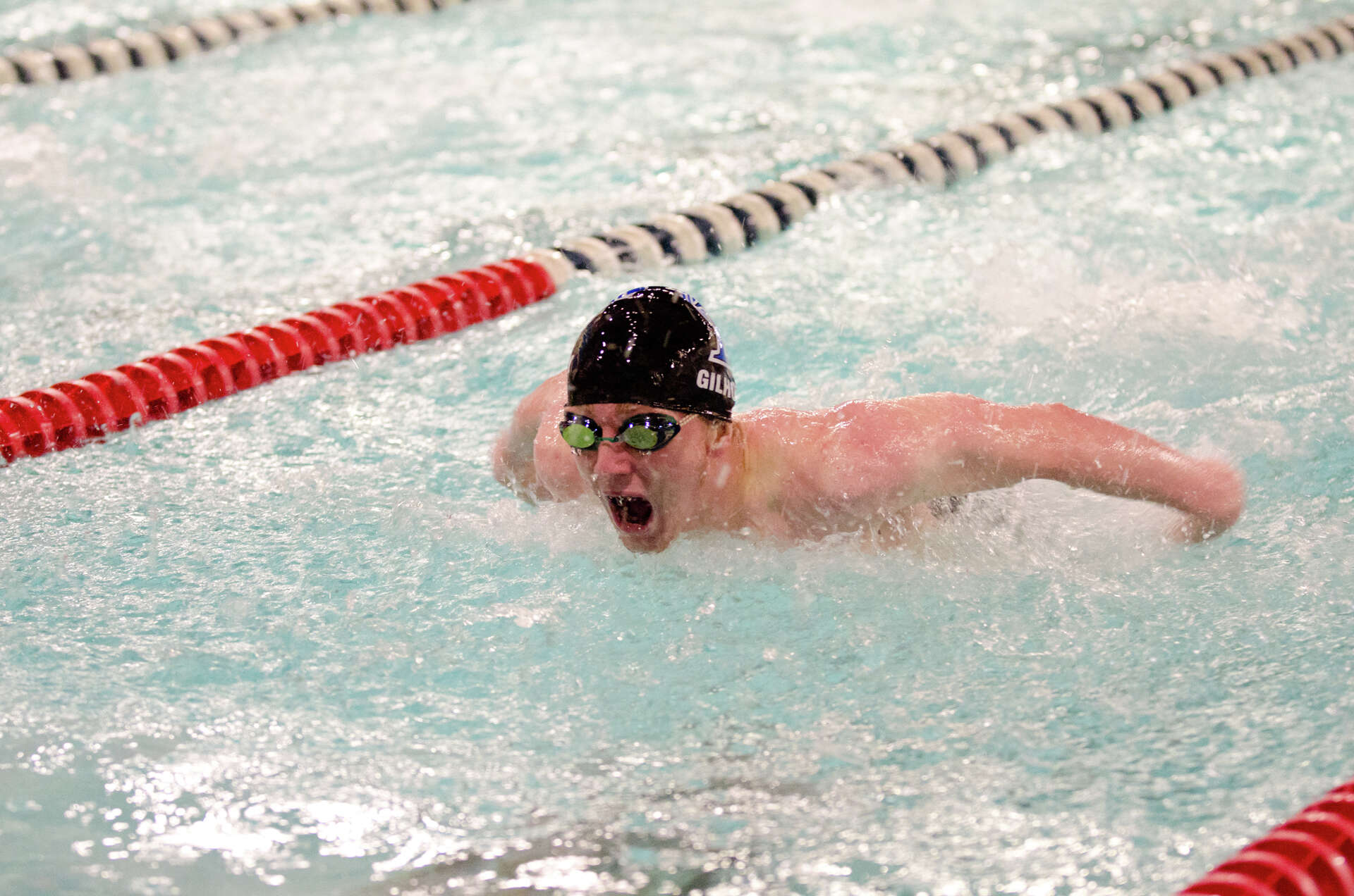New Canaan swims past Darien