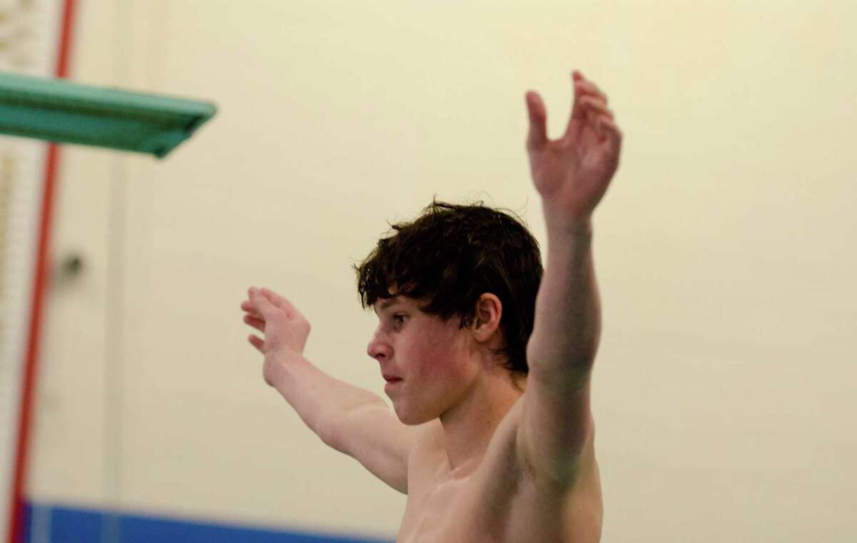 New Canaan swims past Darien