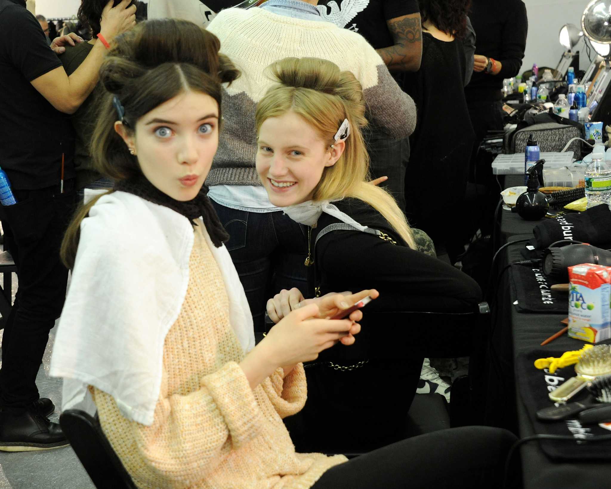Backstage pass: Models prepare to walk