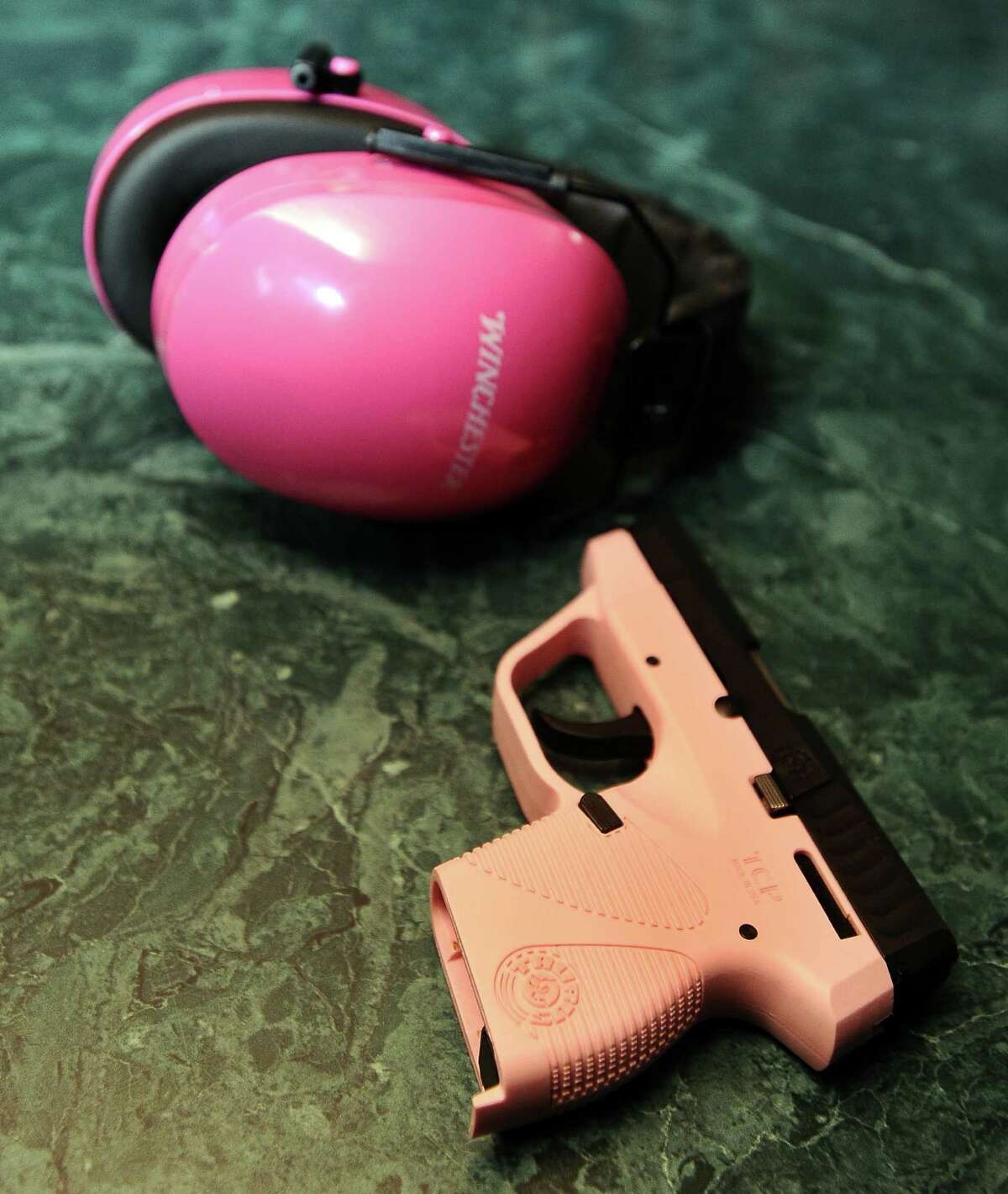 Gun companies target women with pink pistols