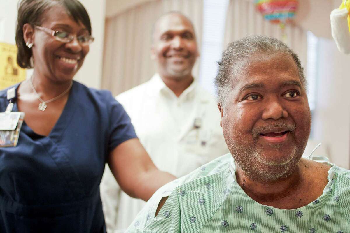 After being at death's door, Houston basketball legend Dwight Jones ...