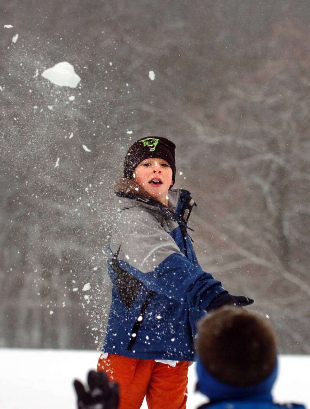 New Year's Eve snow leaves trail of icy roads, crumpled sheet metal