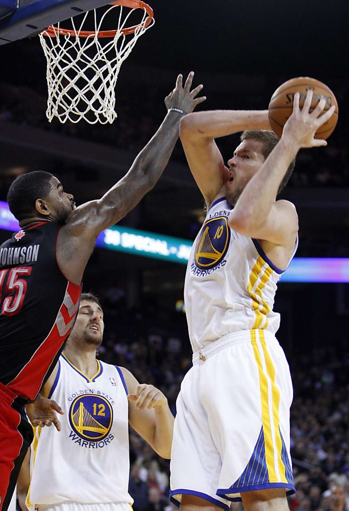 Warriors top Raptors in return home