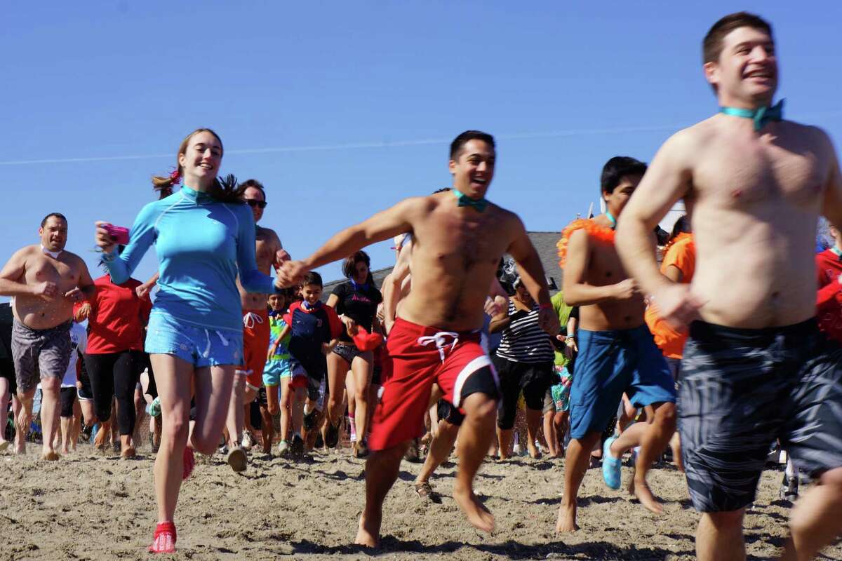 SEEN: Penguin plunge at Compo Beach