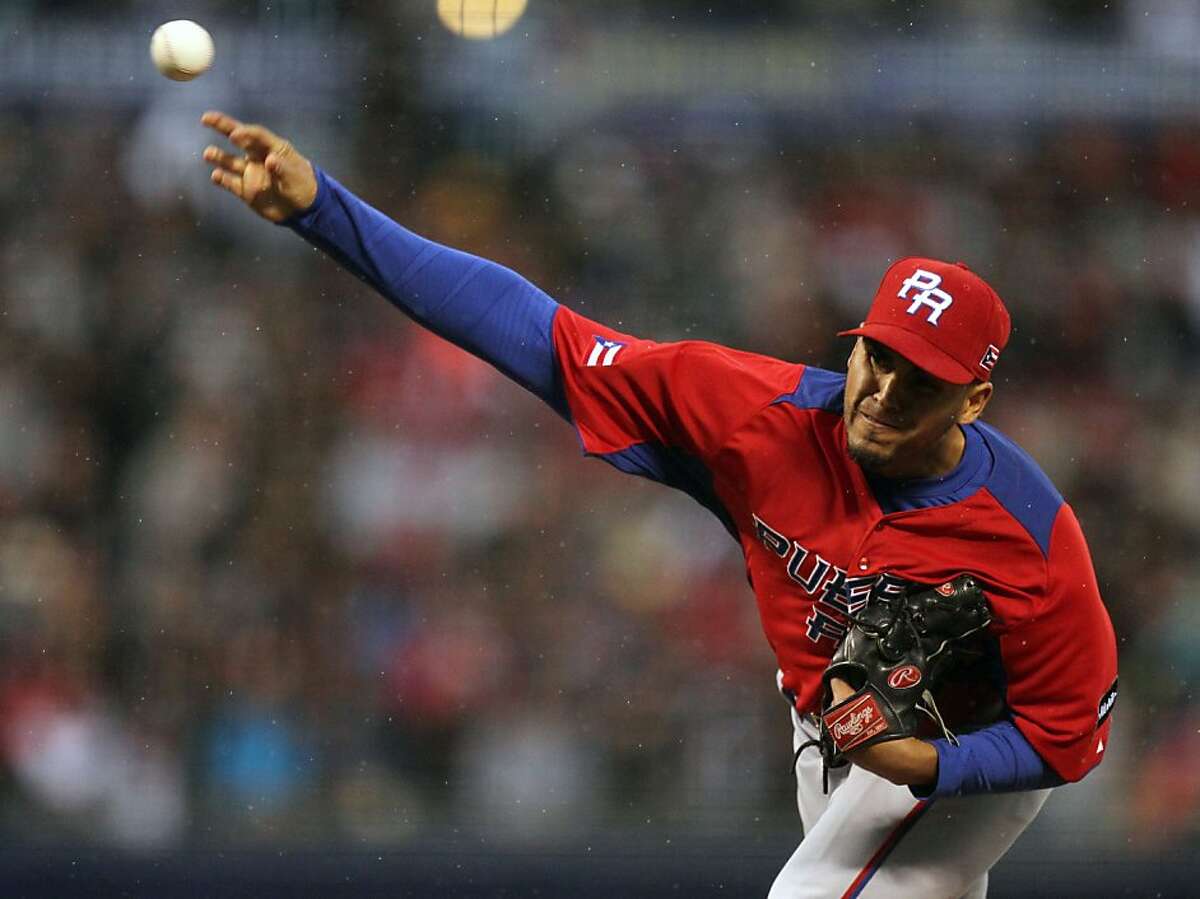 Dominicans top Puerto Rico 3-0, win WBC