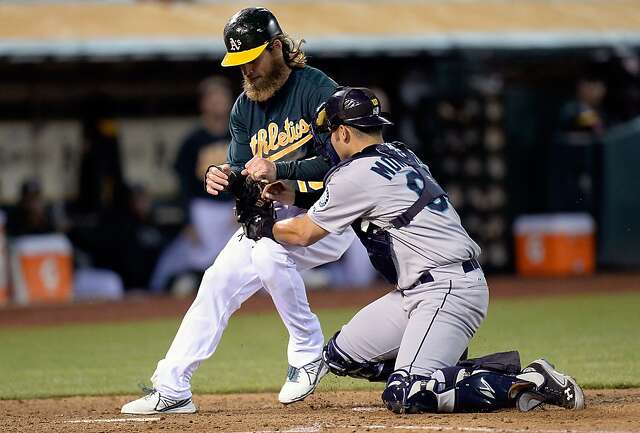 A's break out bats to defeat Mariners