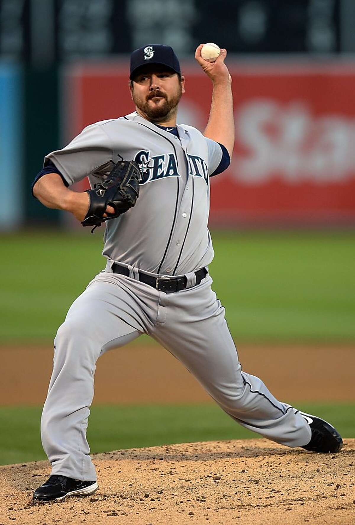 A's break out bats to defeat Mariners