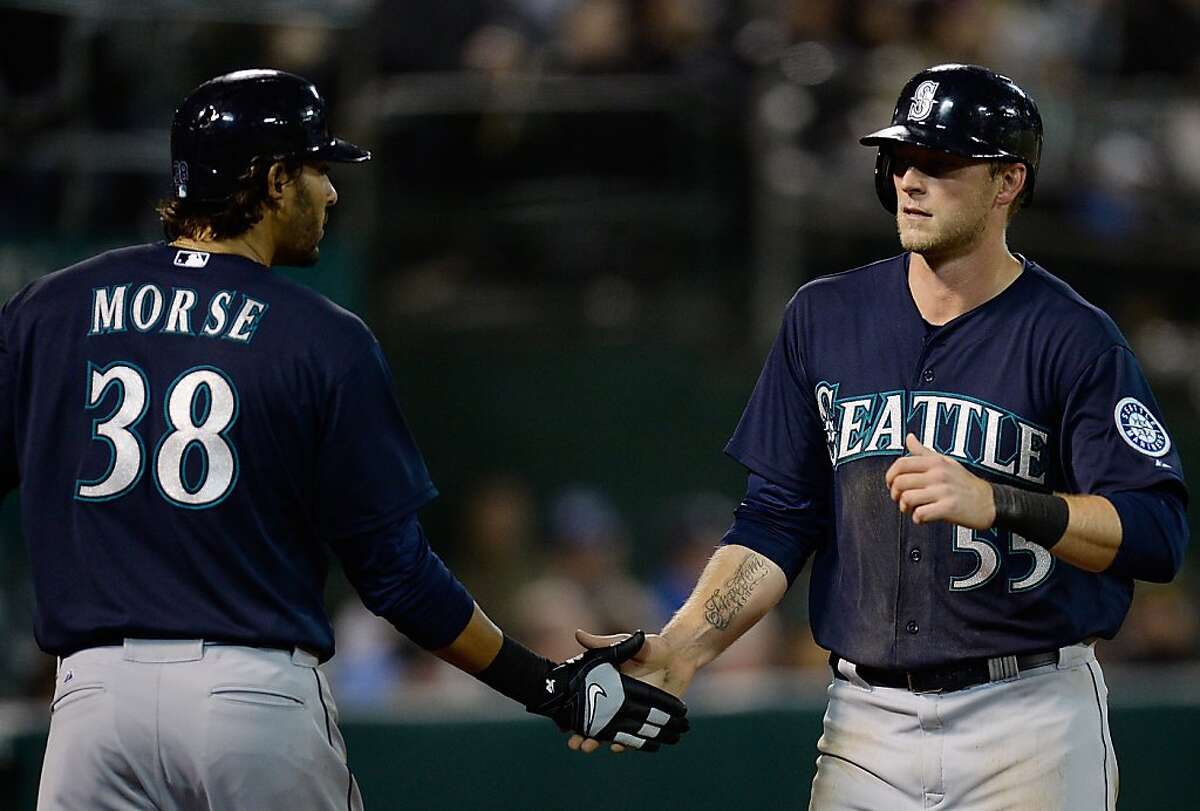 A's break out bats to defeat Mariners