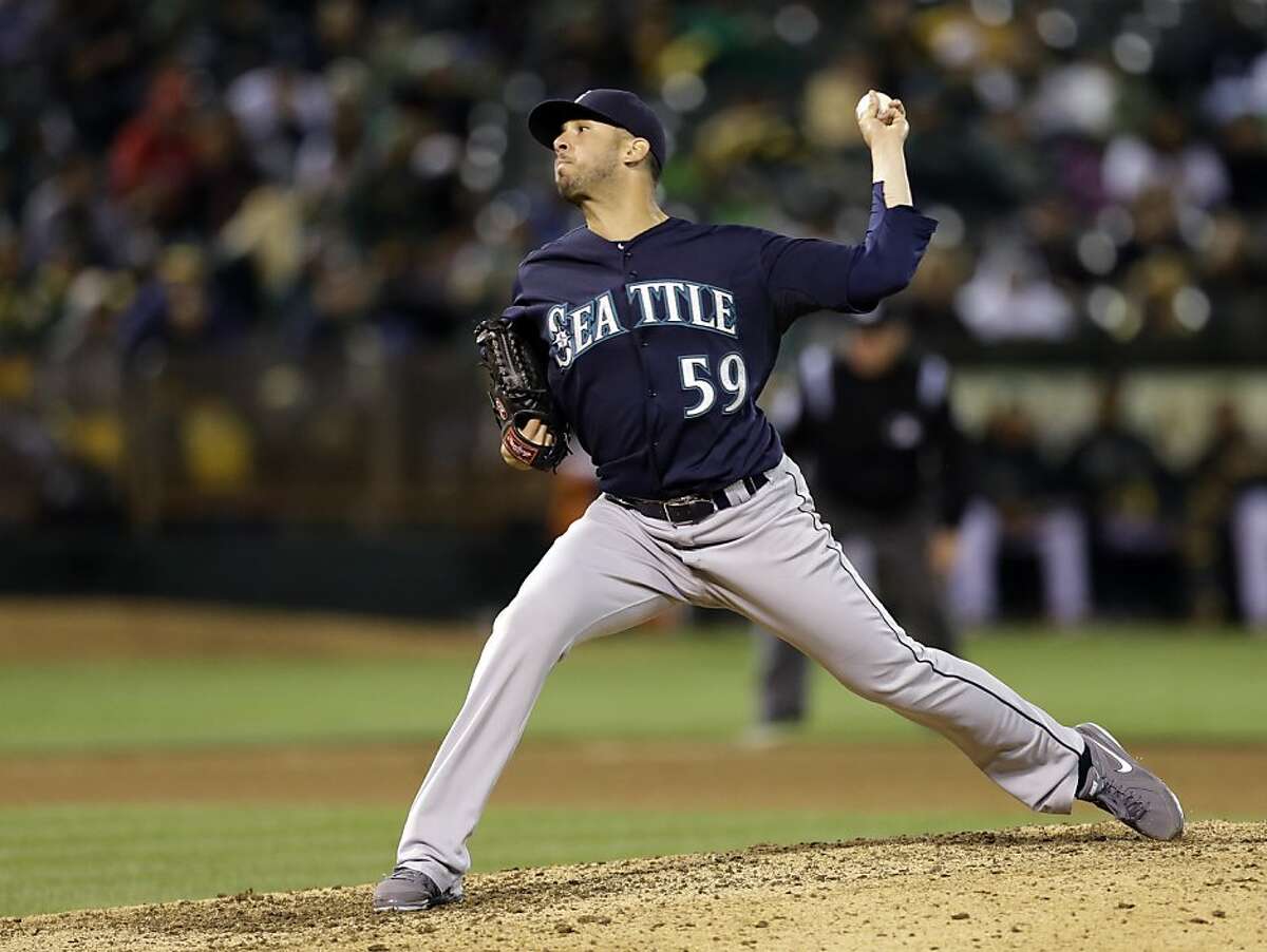 A's break out bats to defeat Mariners