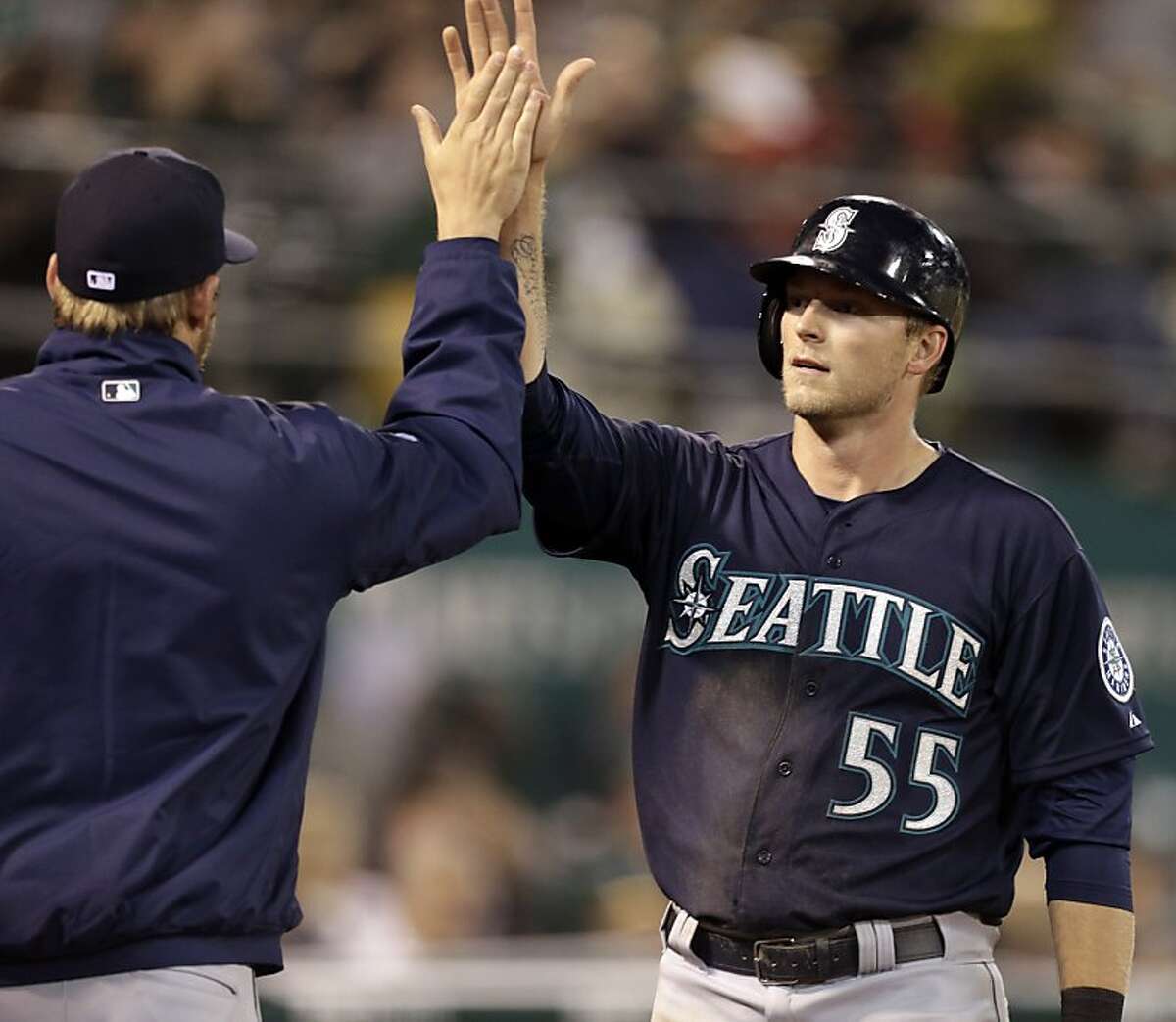 A's break out bats to defeat Mariners