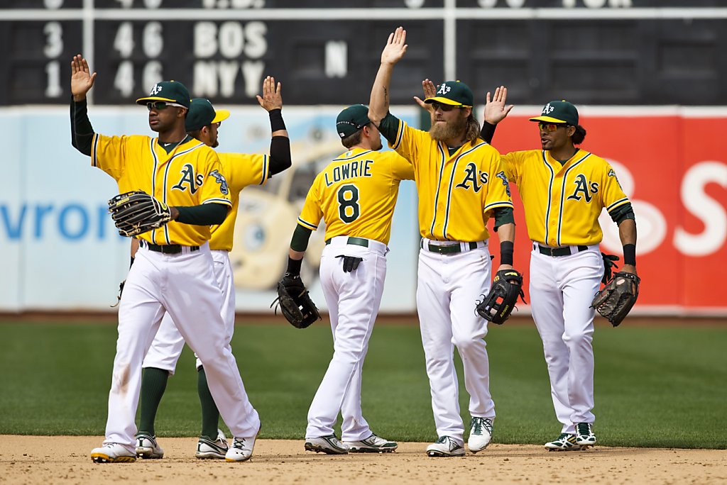 Bats awaken in A's 8-2 win over Mariners