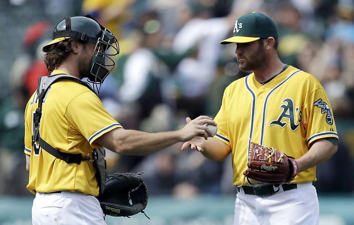 Bats waken in A's 8-2 win over Mariners