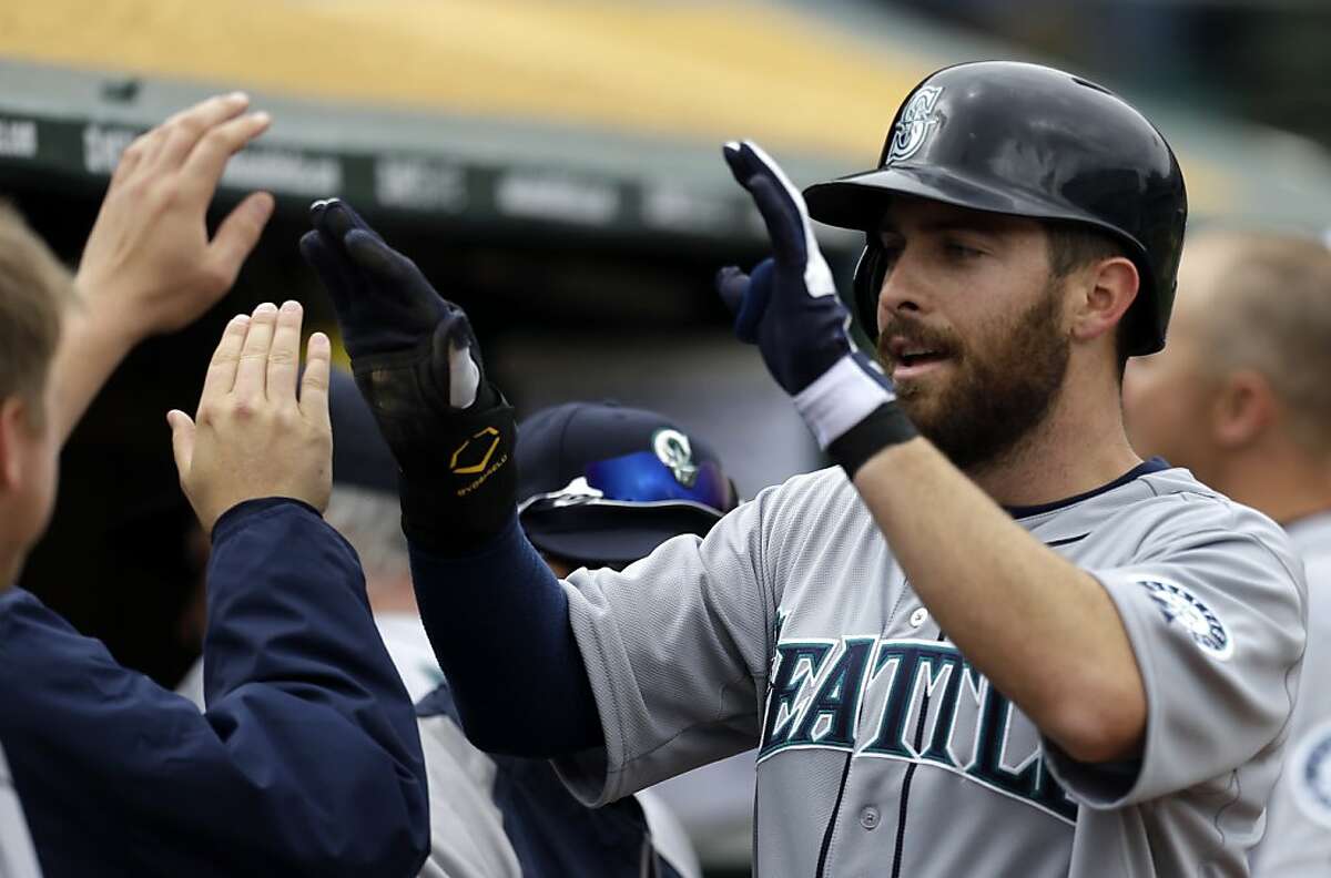 Bats waken in A's 8-2 win over Mariners