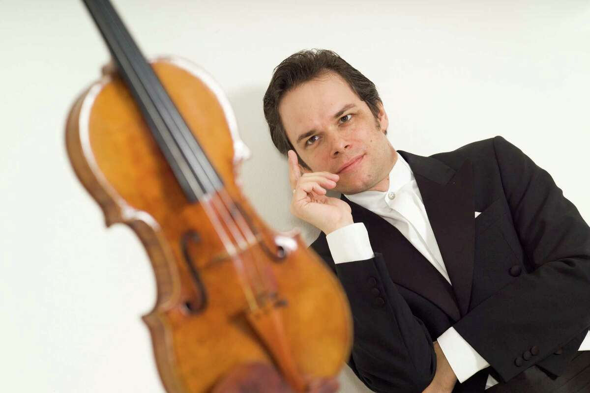 Violinist shares stage with pricey instrument