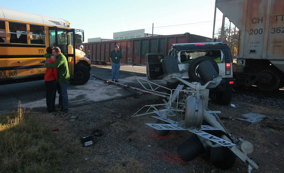 Train hits vehicle, school bus damaged