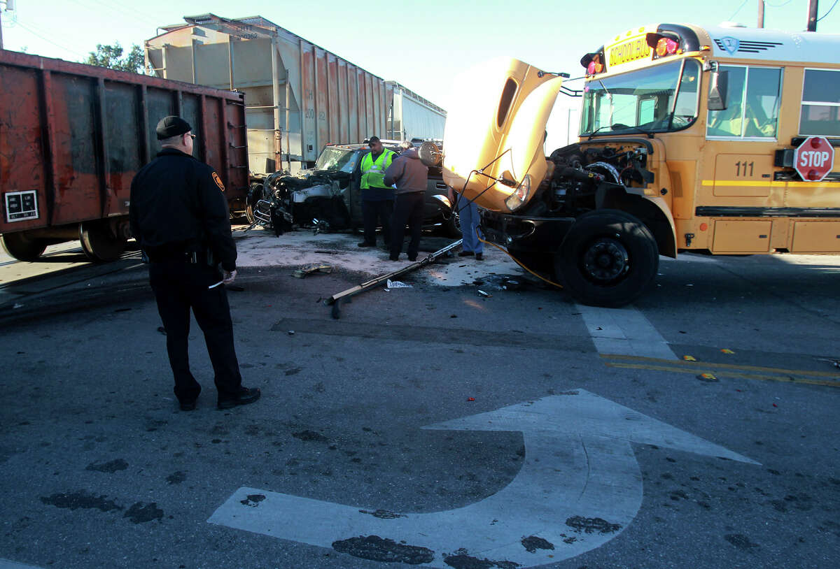 Train hits vehicle, school bus damaged