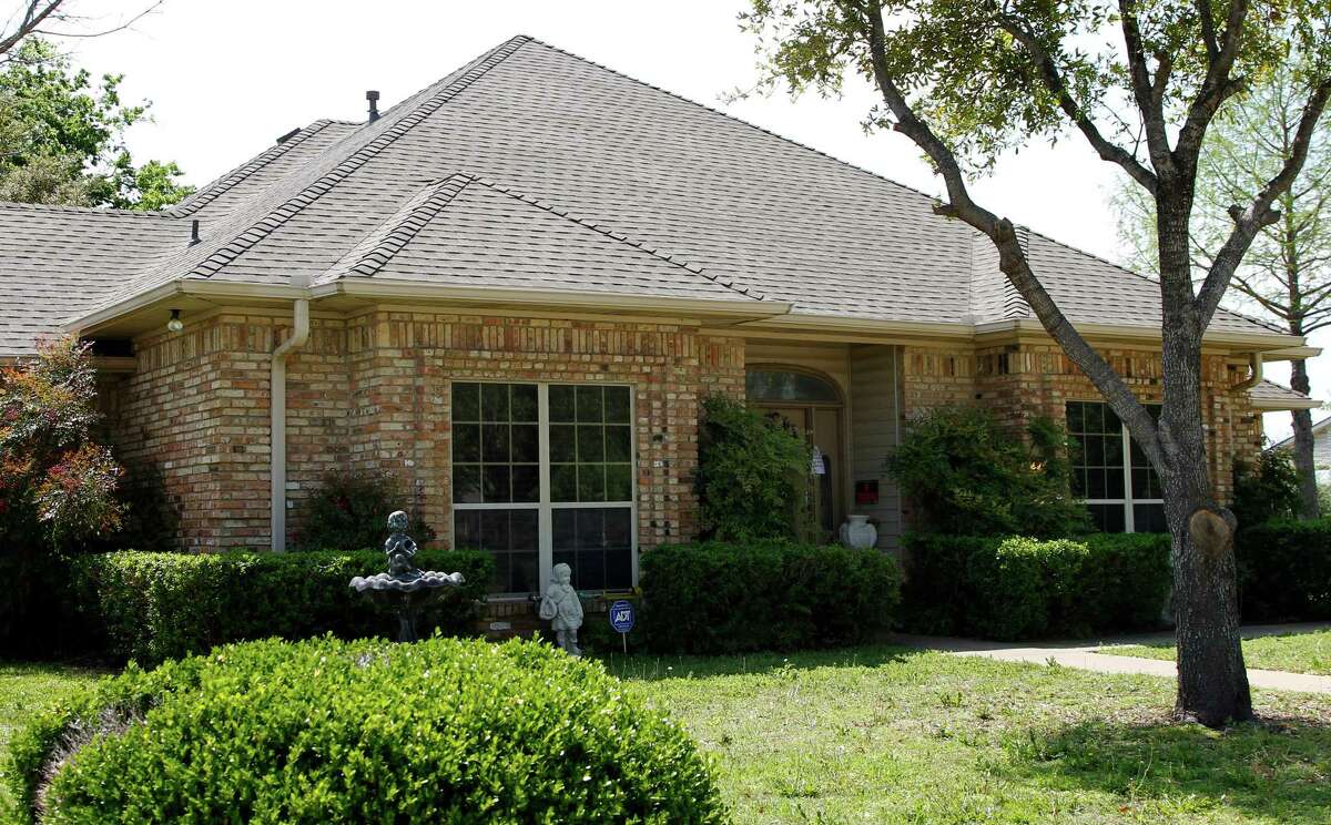 Ex-official's wife says husband shot DA