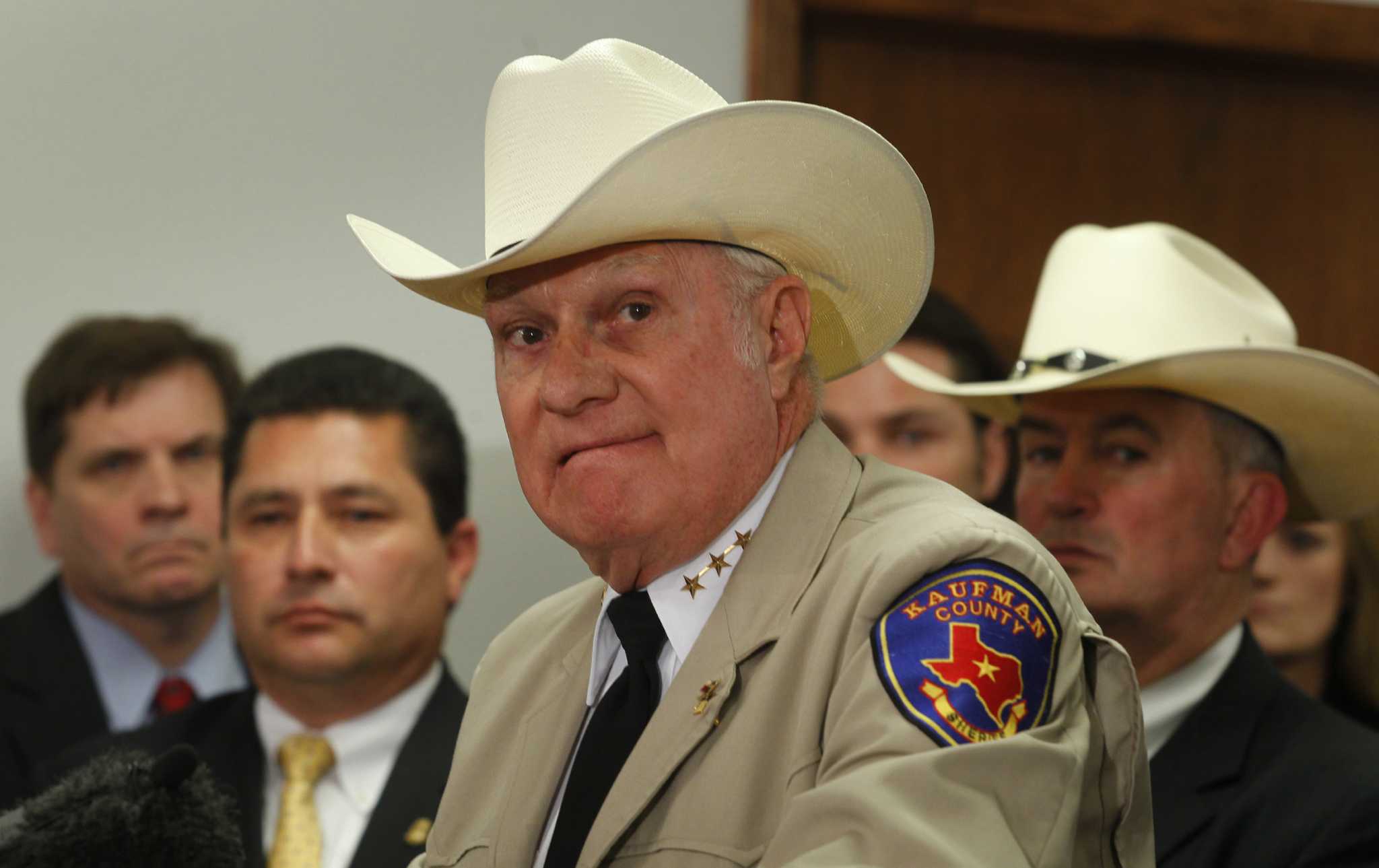 Former official charged in Texas DA slayings