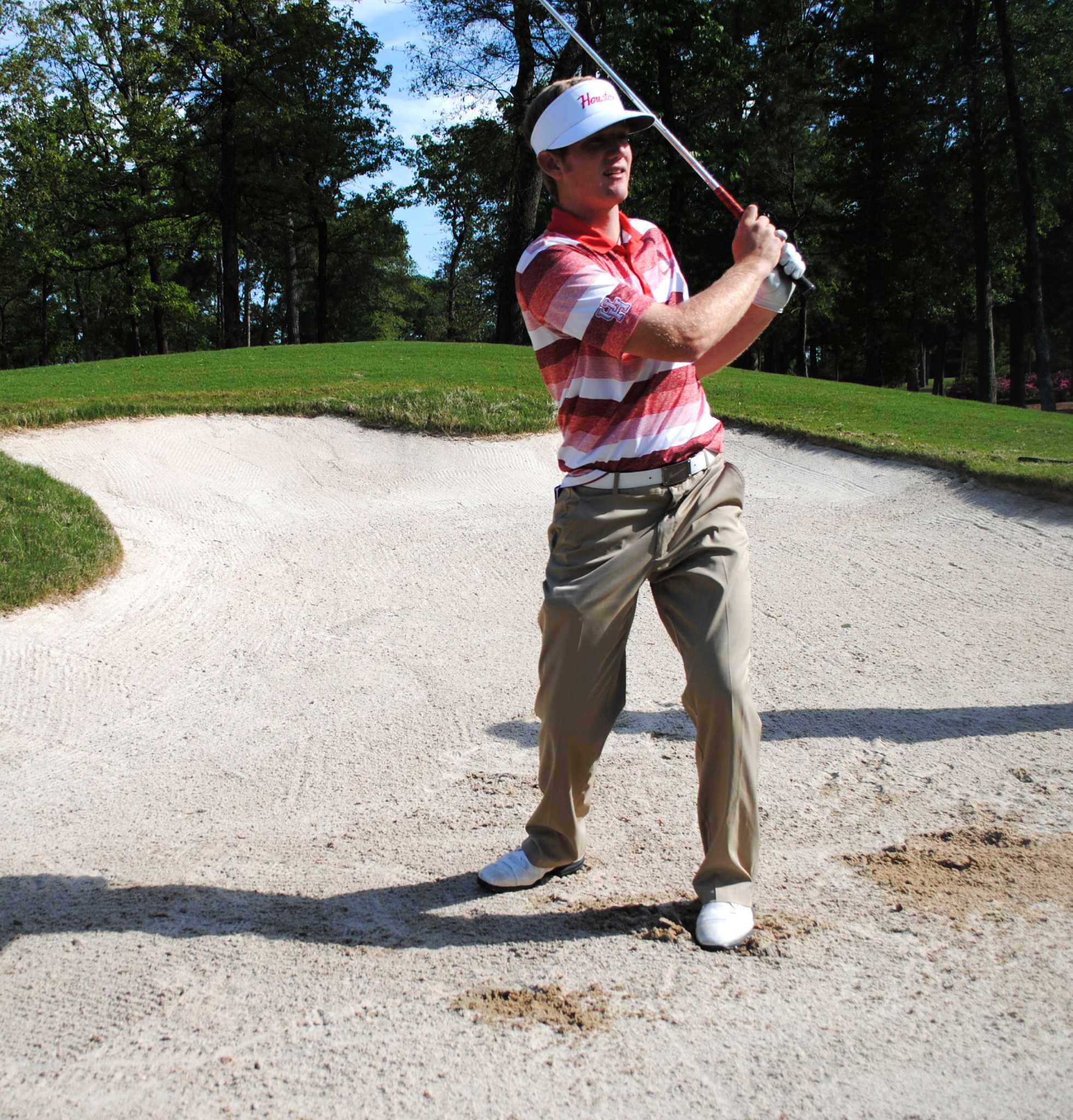 Golfer Reed riding new game plan up leaderboards at Houston