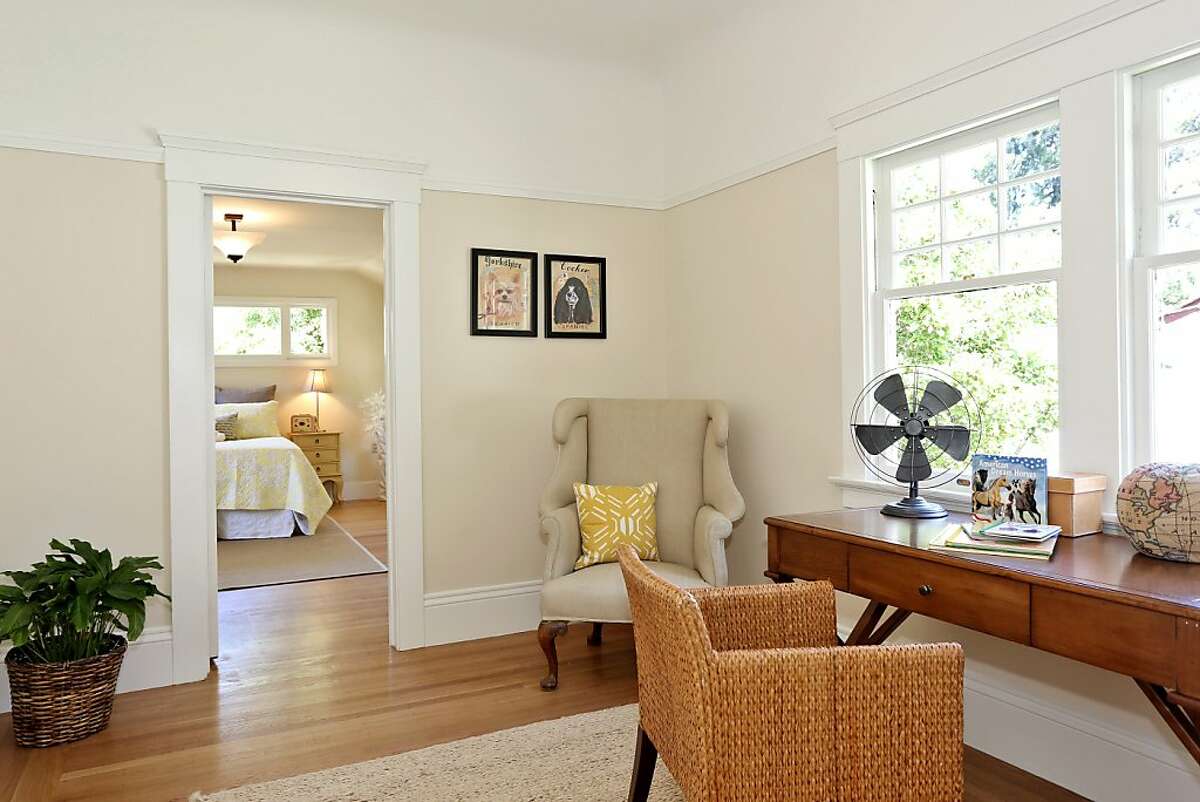 Oakland Dutch Colonial boasts fireplace