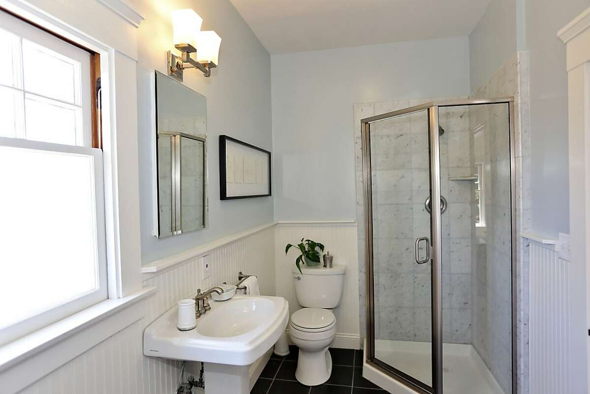 Oakland Dutch Colonial boasts fireplace