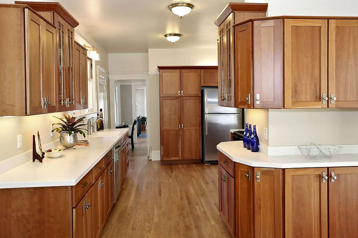 Oakland Dutch Colonial boasts fireplace