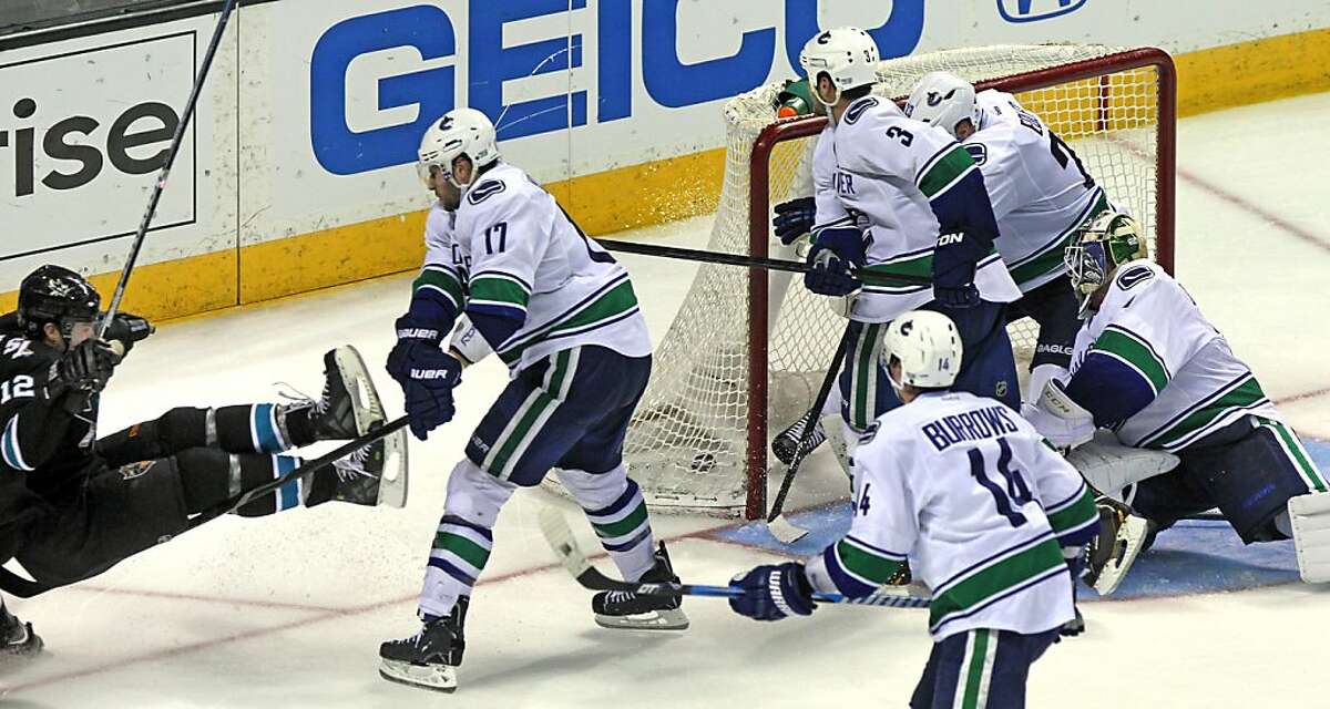 Sharks beat Canucks 4-3, sweep series