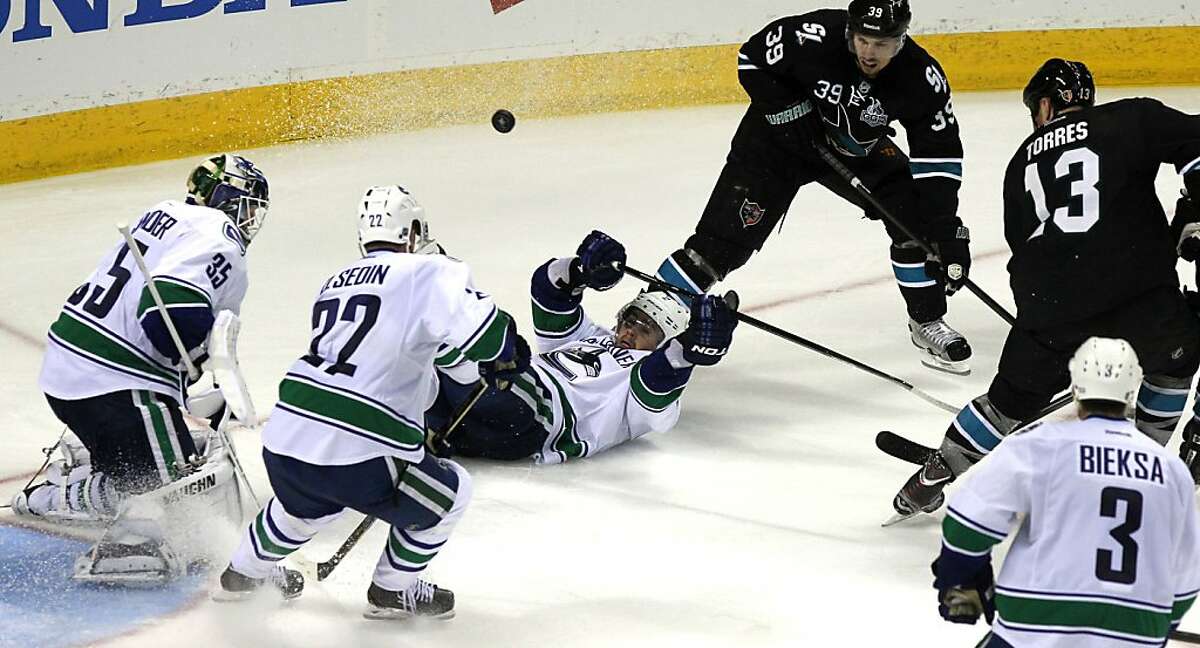 Sharks beat Canucks 4-3, sweep series