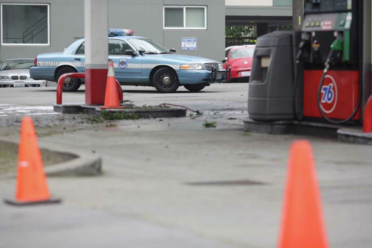 Traffic blocked after car rams gas pumps on First Hill