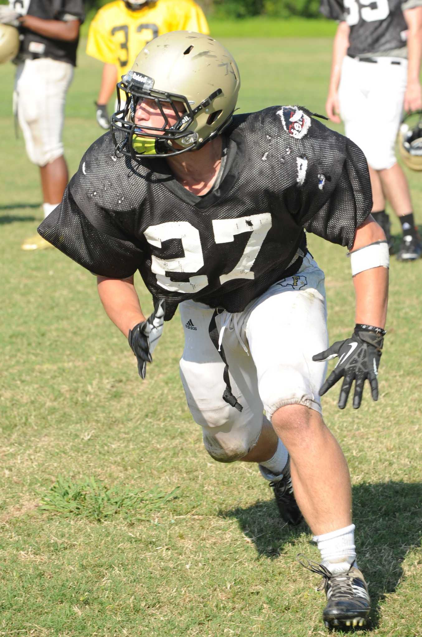 New Foster football coach oversees spring drills