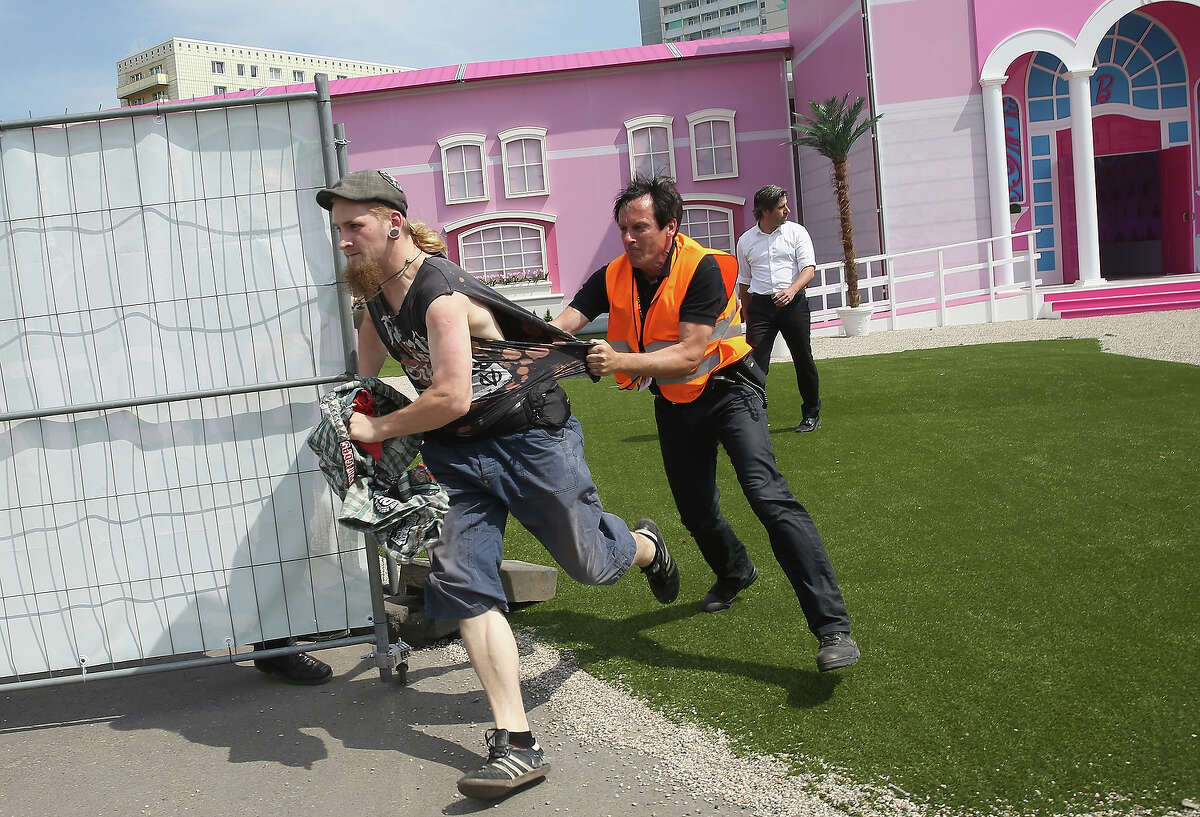 Activists protest life-size Barbie's 'Dreamhouse'