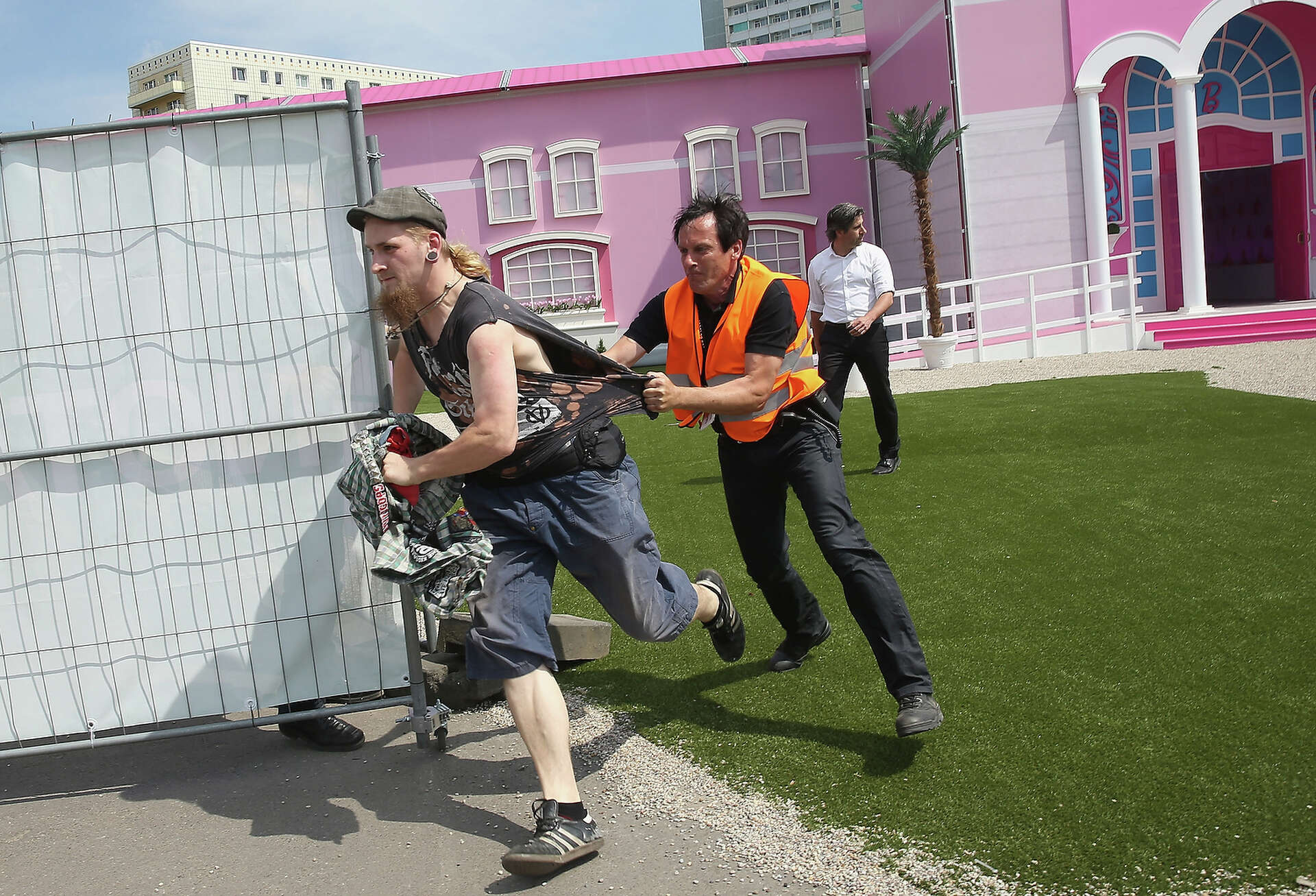 Activists protest life-size Barbie's 'Dreamhouse'