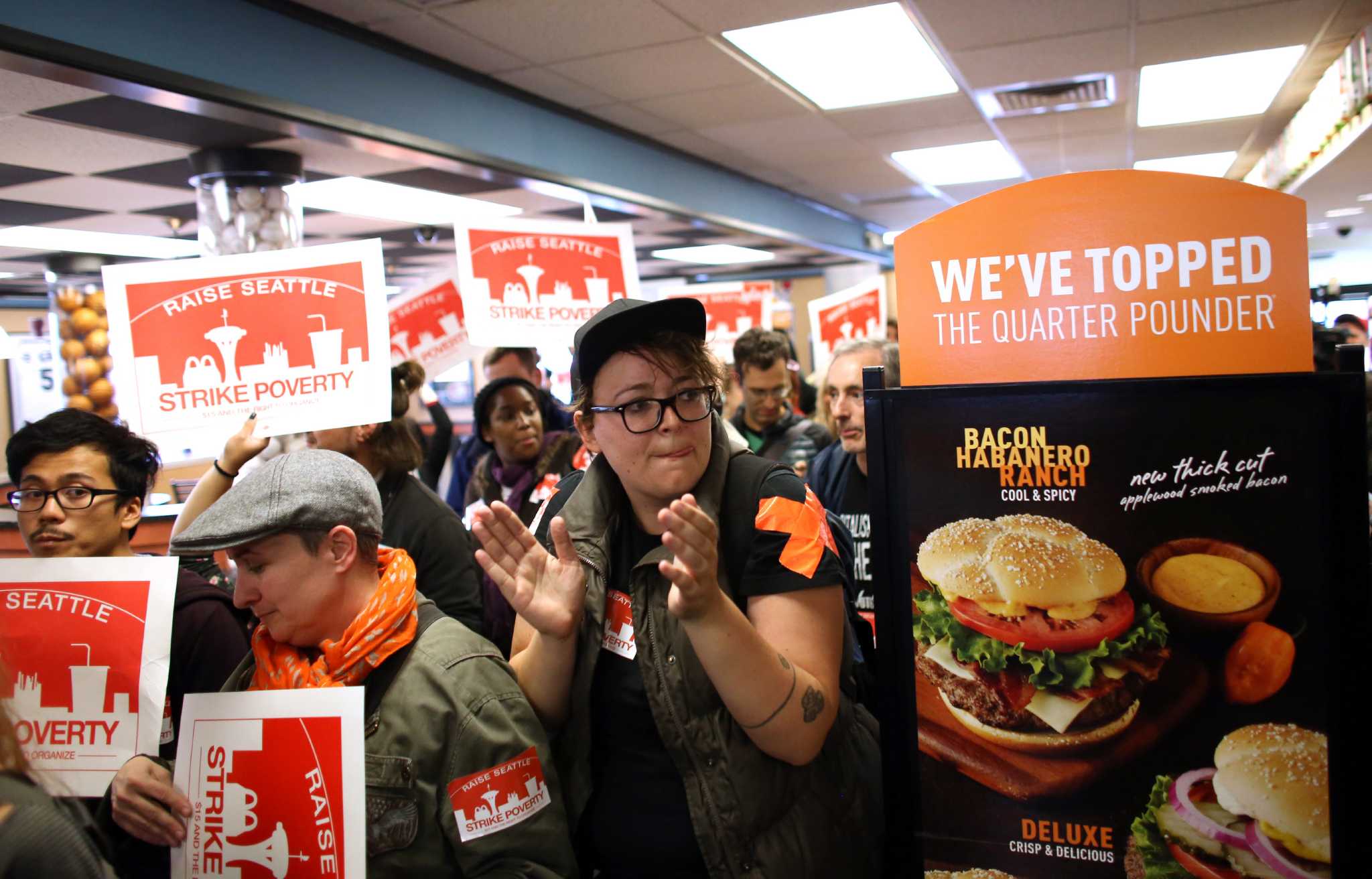 Seattle fast food workers strike, march