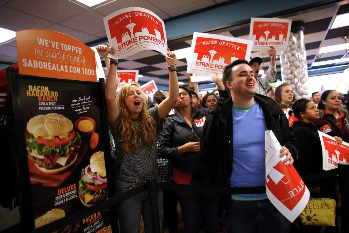 Seattle fast food workers strike, march