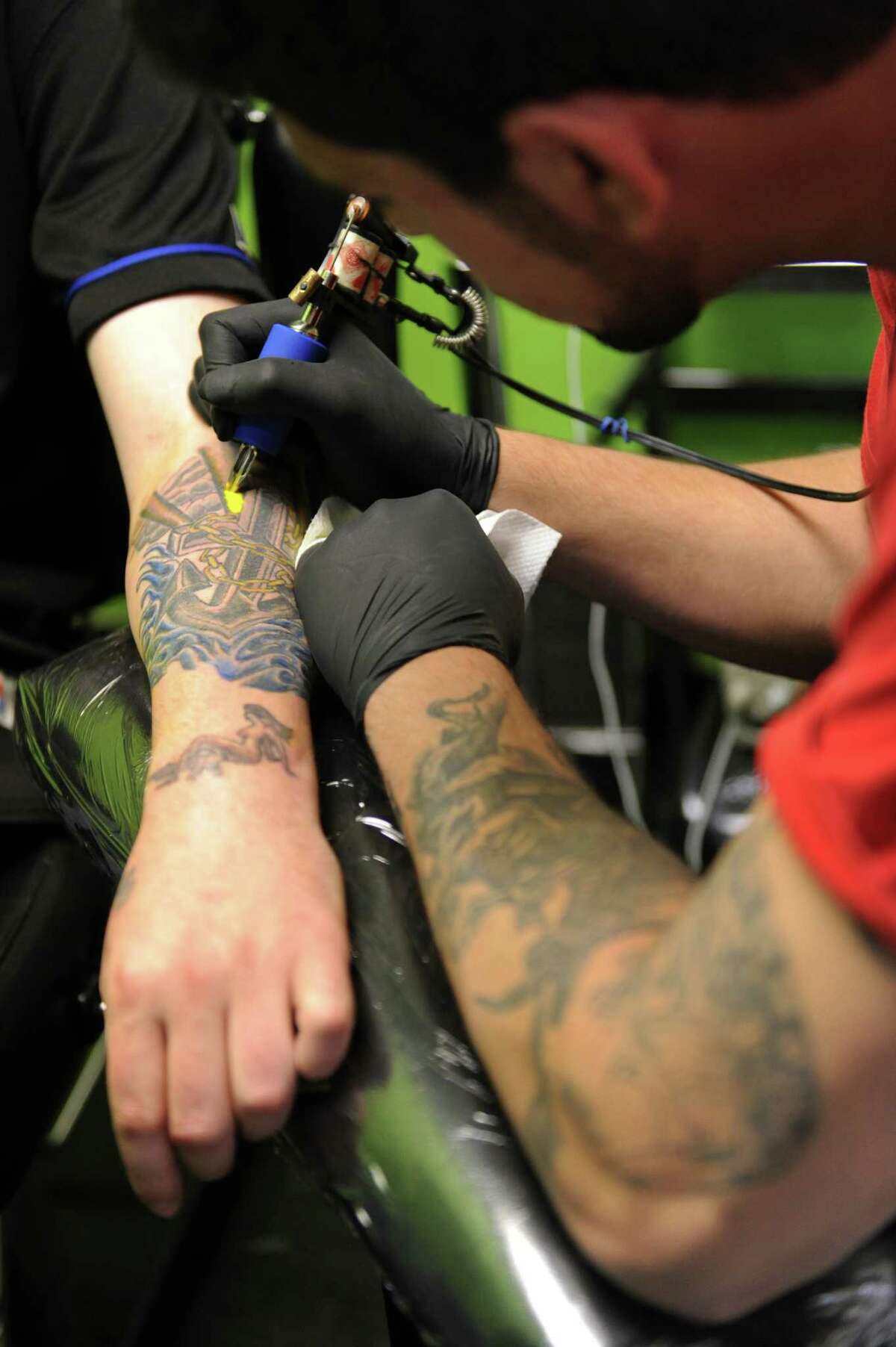 State considers licensing tattoo artists