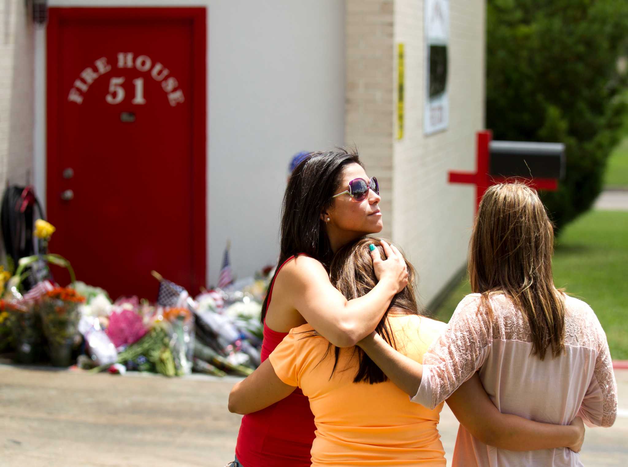 In shell of burned building, investigators look for source of deadly fire