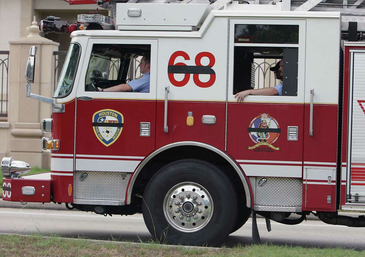 Somber procession forms wall of honor for fallen firefighters