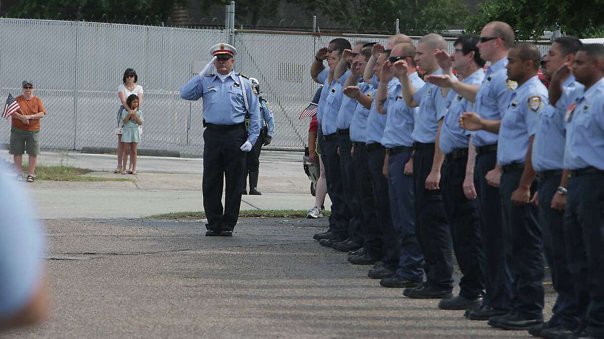Somber procession forms wall of honor for fallen firefighters
