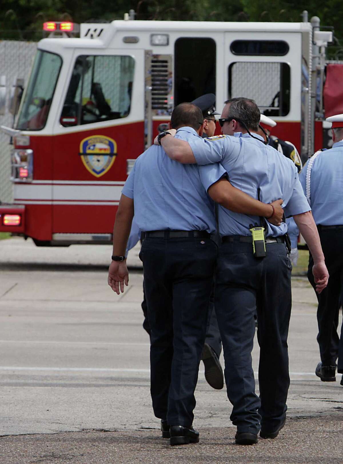Somber procession forms wall of honor for fallen firefighters