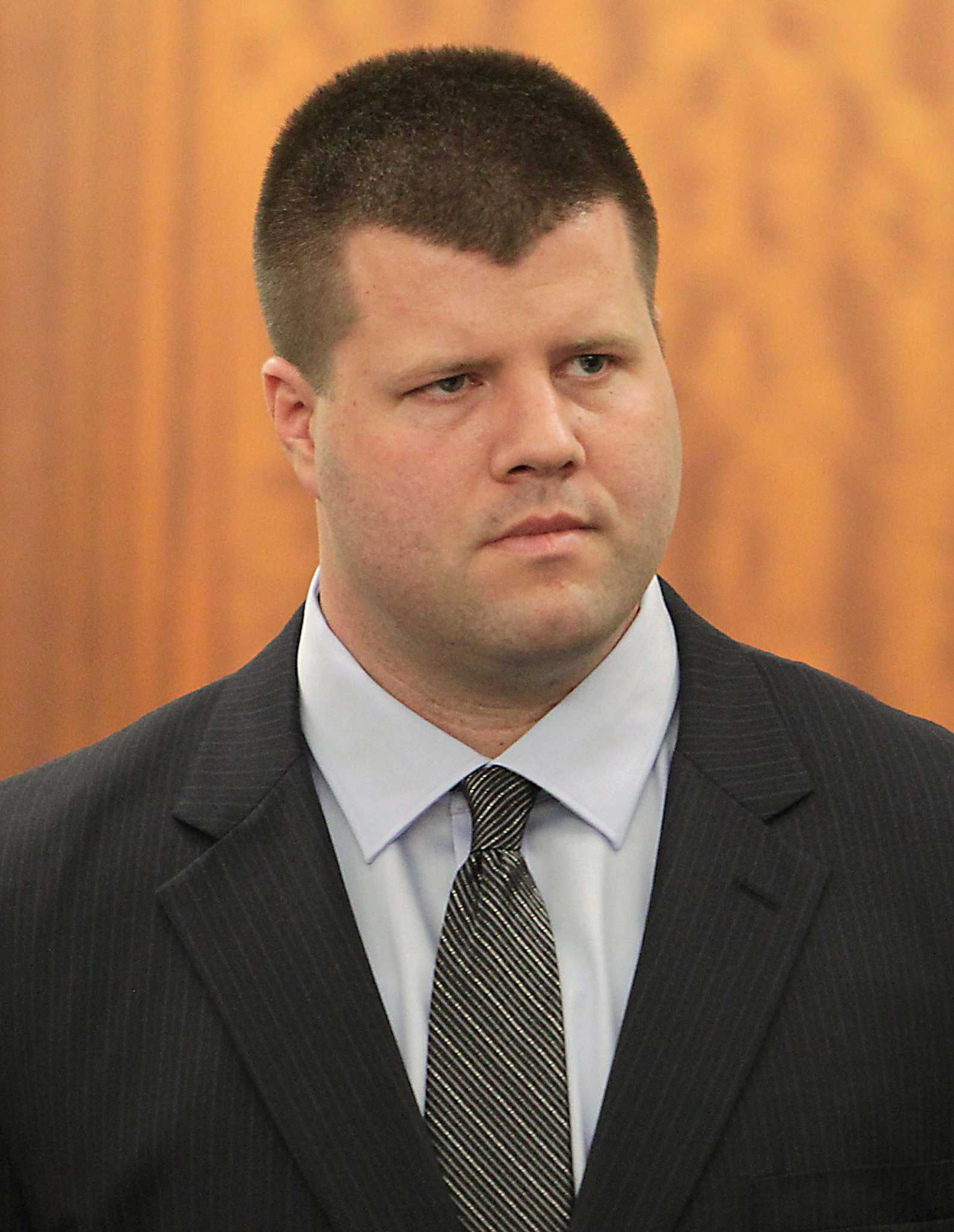 Ex-officer denies kicking Holley in videotaped beating